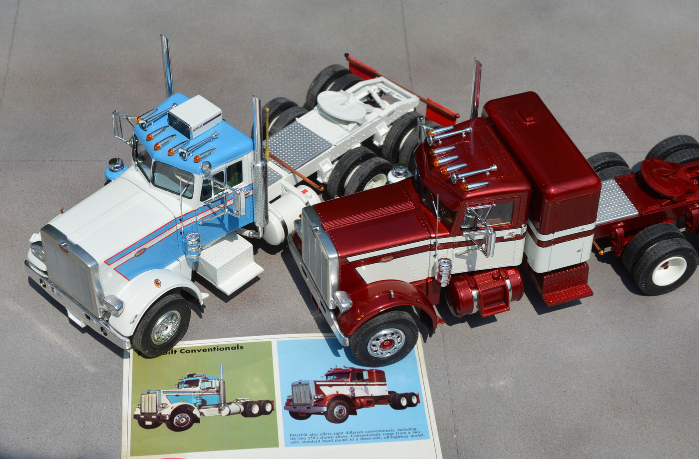 Photo: Dark red and White and blue 359 with brochure above 7 31 24 ...